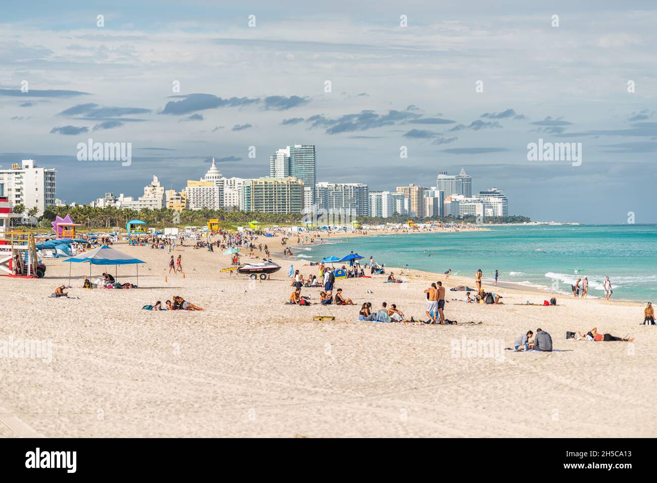 Miami Beach, USA - January 17, 2021: Many people at South Beach sand ...