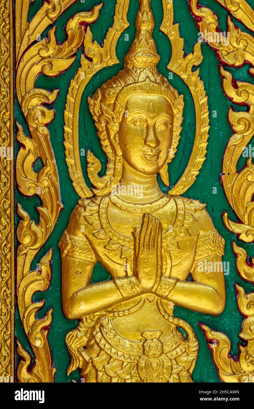 golden thailand temple buddhist deity or god, golden painted thai icon ...