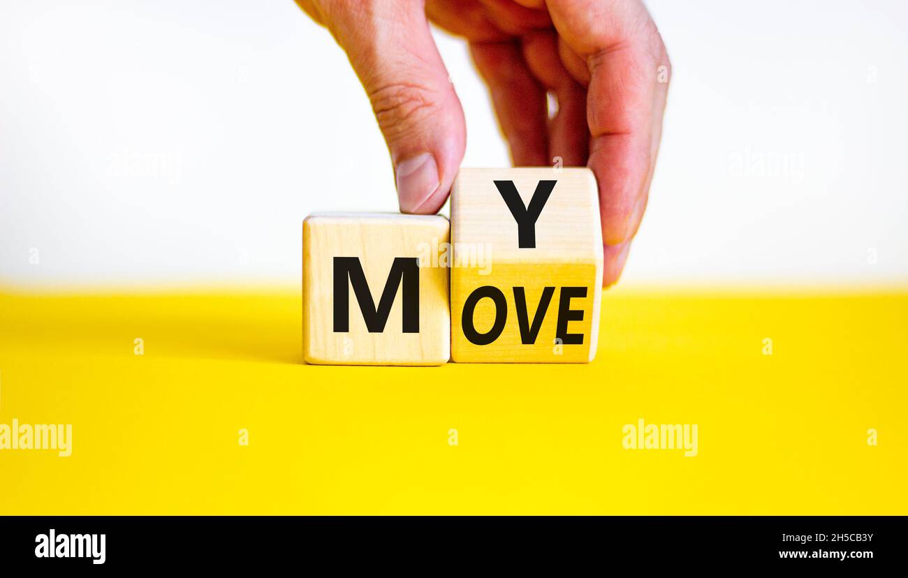 Make my move symbol. Businessman turns the wooden cube with words 'My ...