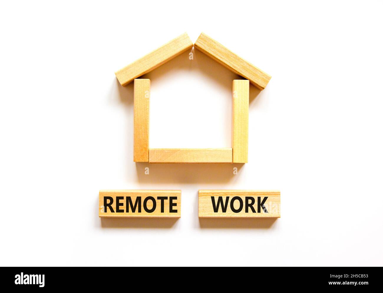 Remote work symbol. Concept words 'Remote work' on wooden blocks near ...