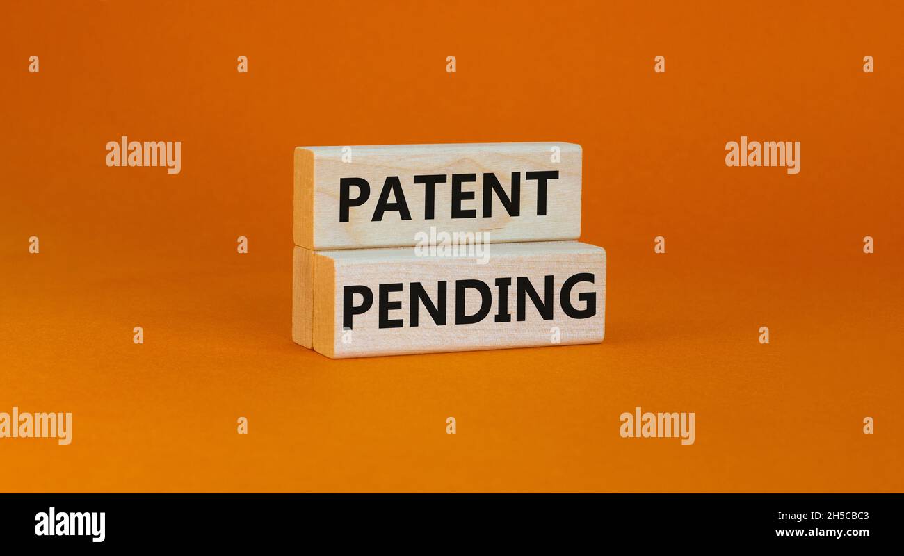 Time to patent pending symbol. Concept words Patent pending on wooden ...