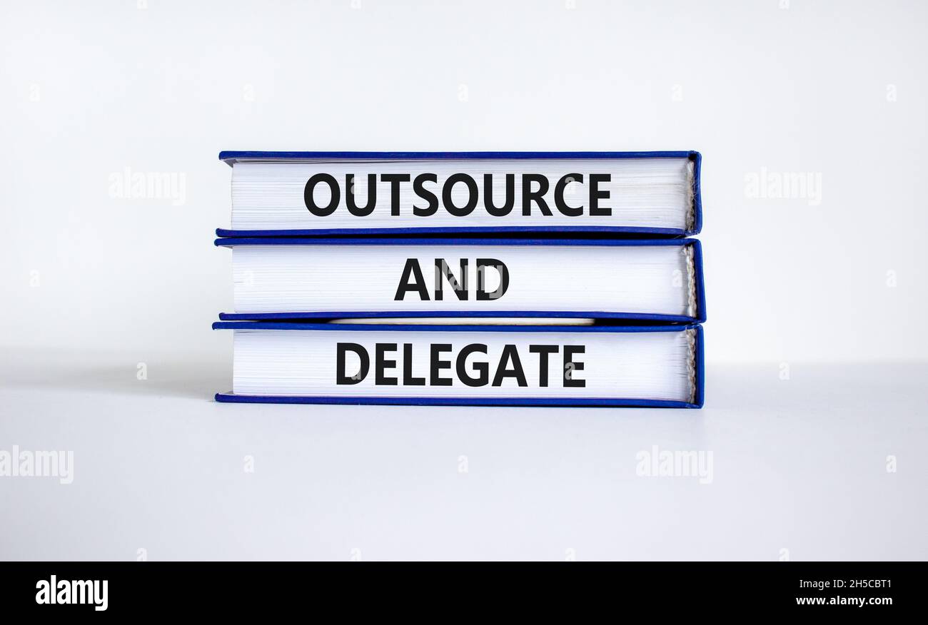 Outsource and delegate symbol. Concept words 'Outsource and delegate ...