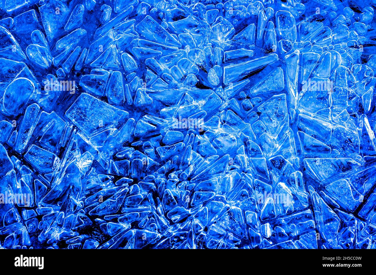Frozen ice patterns in winter cold freezing water crystals shapes Stock ...