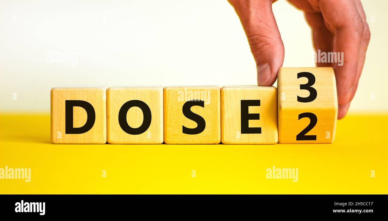 Covid-19 booster dose vaccine shot symbol. Doctor turns cubes and ...