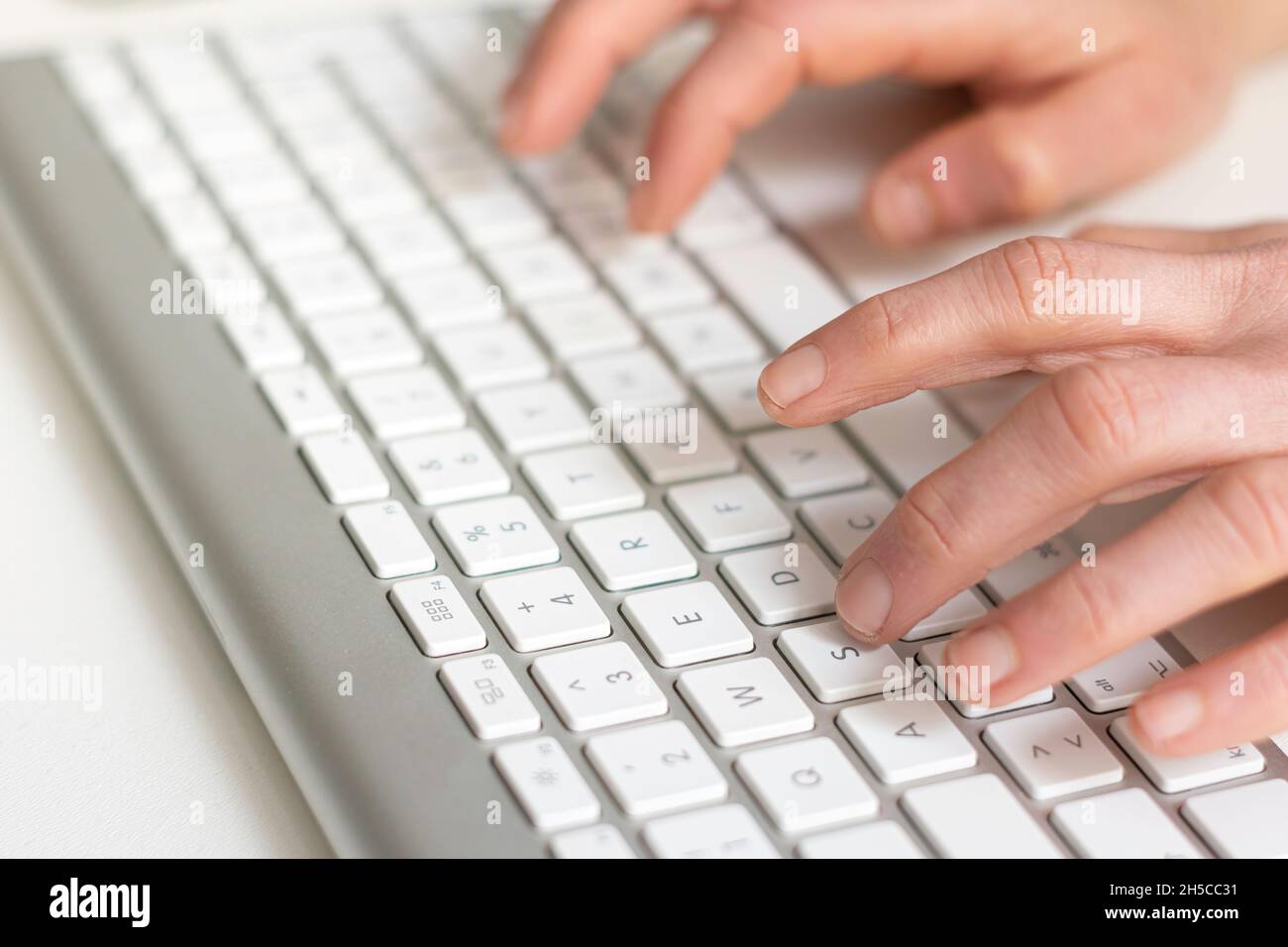 Hands typing with the computer keyboard. Business and education concept ...