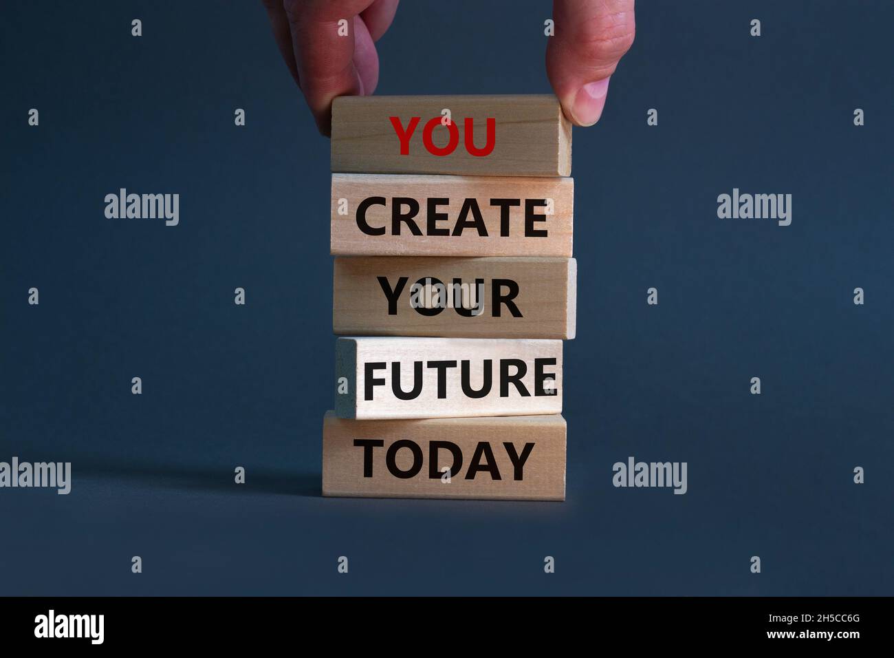 You create your future today symbol. Wooden blocks, words 'You create ...