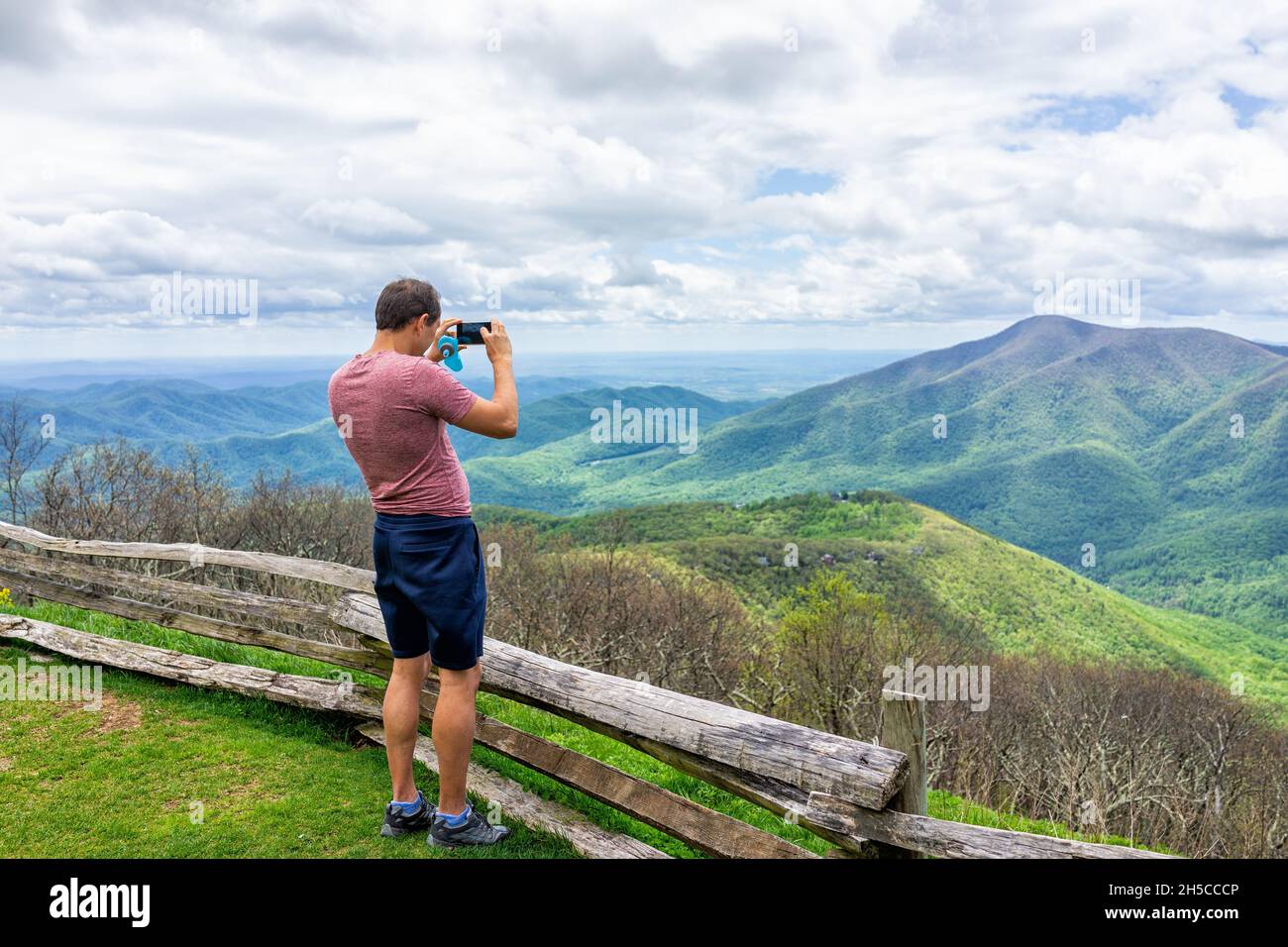 Devil's Knob overlook with man standing photographing taking picture of ...