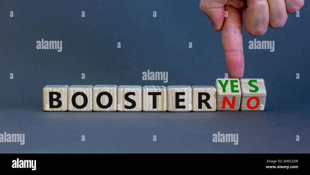 Covid-19 booster vaccine shot yes or no symbol. Doctor turns wooden ...