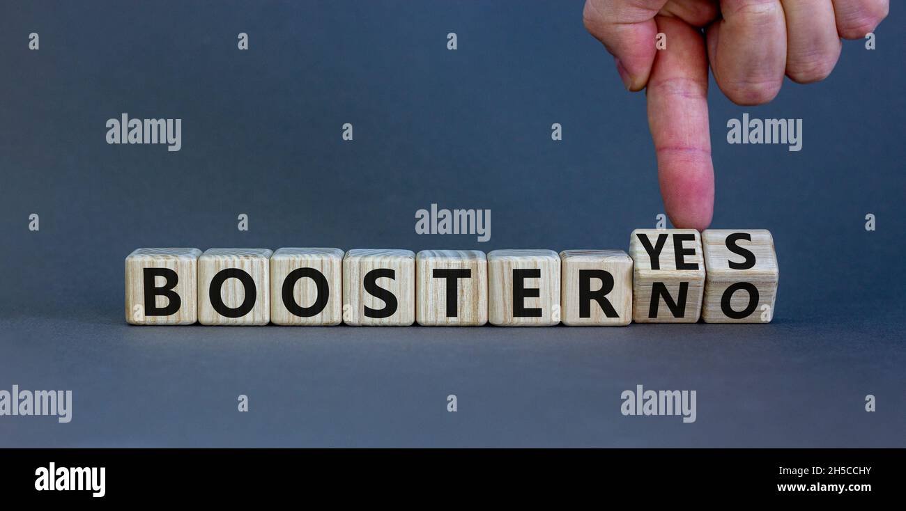 Covid-19 booster vaccine shot yes or no symbol. Doctor turns wooden ...