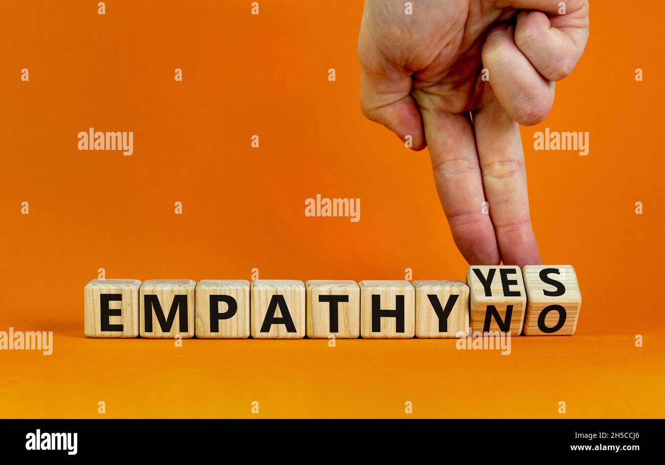 Empathy yes or no symbol. Psychologist turns wooden cubes and changes ...