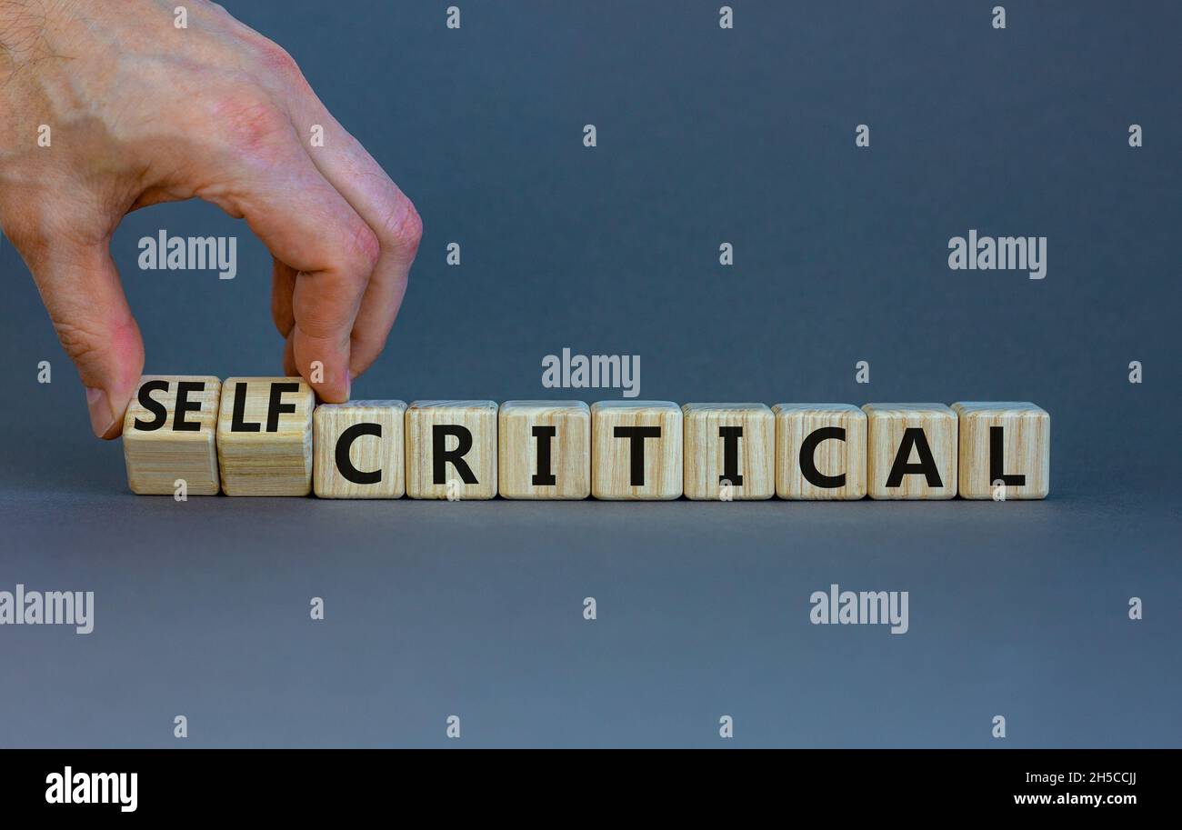 Critical or self-critical symbol. Wooden cubes with words Self-critical ...