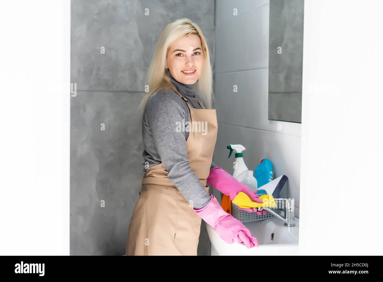 beautiful young cleaner cleaning office Stock Photo - Alamy