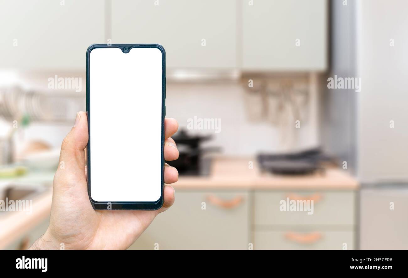 Kitchen table with blank screen smartphone hi-res stock photography and ...