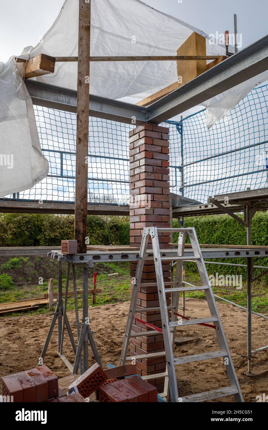 a brick pillar supports a house on a construction site Stock Photo - Alamy
