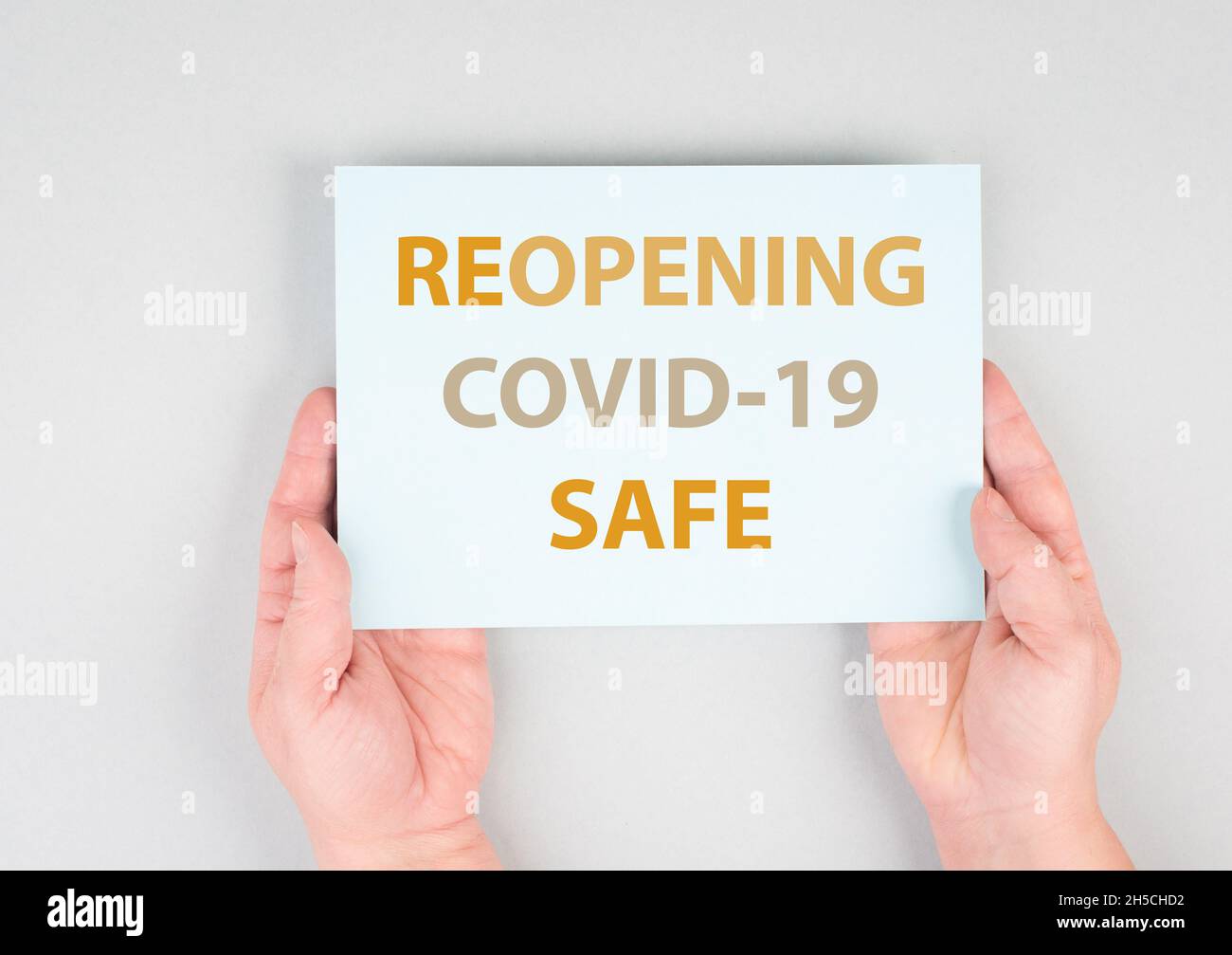 Reopening covid-19 safe, hands hold paper, message, information ...