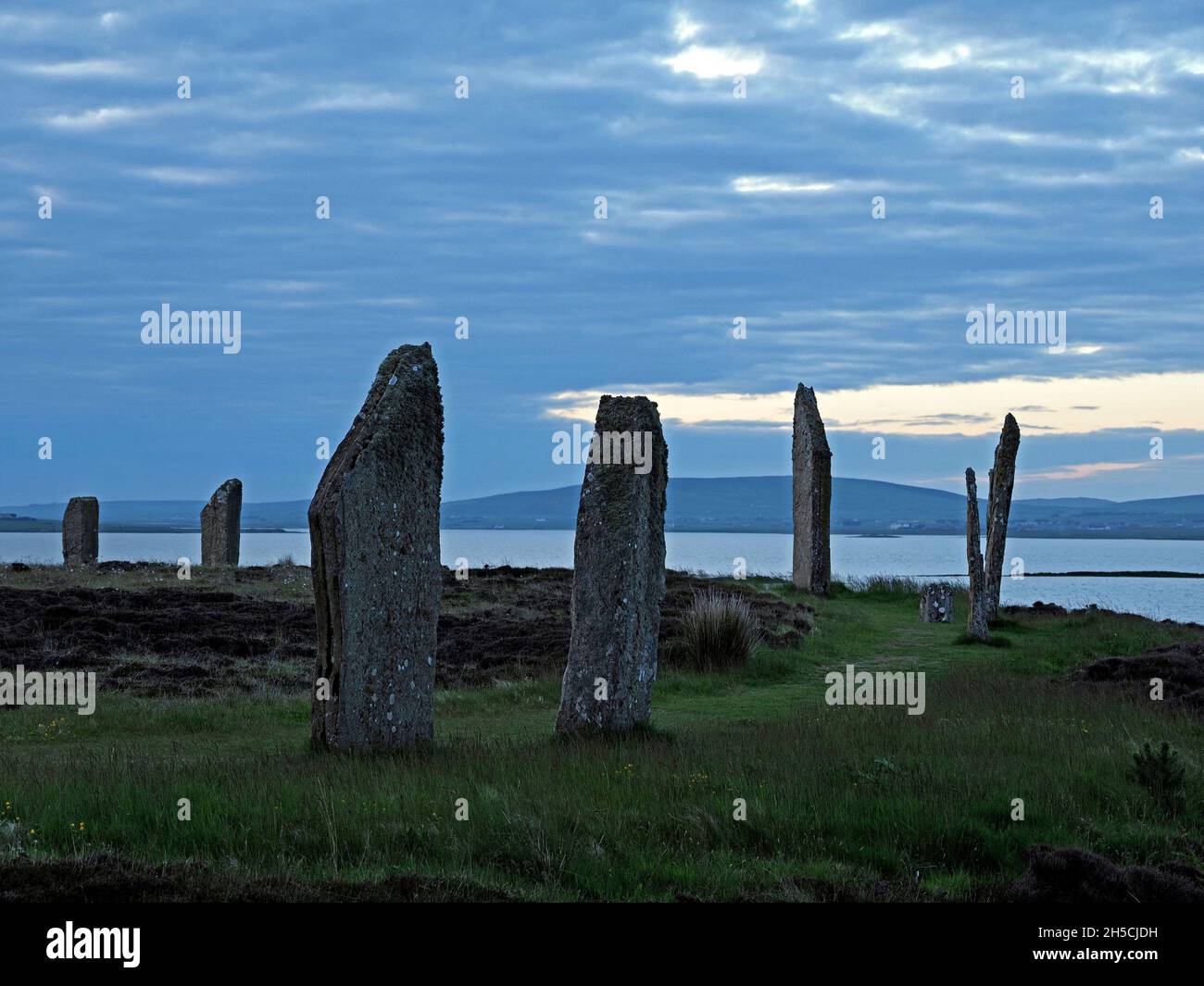 massive upright standing stones at dusk in the 21 stone circle known as ...