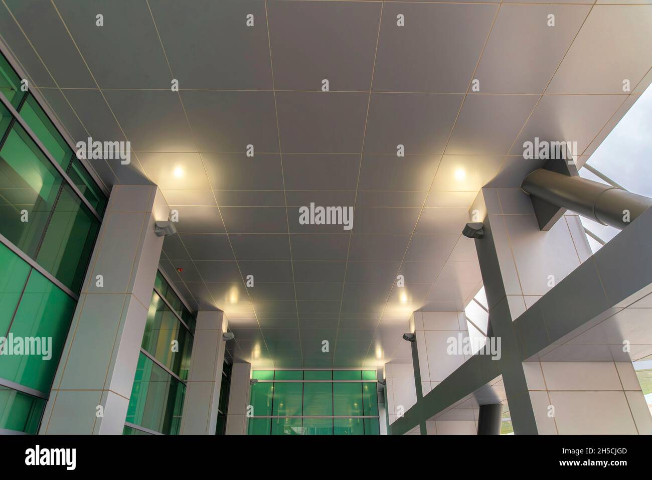 Light gray ceiling tiles and columns inside a building at Salt Lake ...