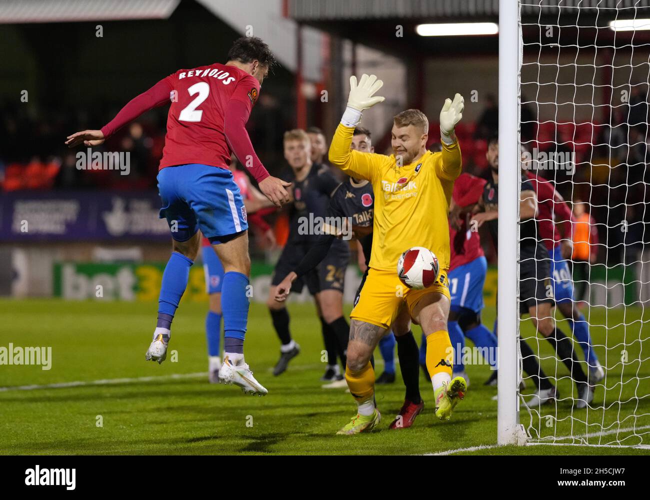Dagenham and Redbridge's Callum Reynolds sees an effort saved by ...