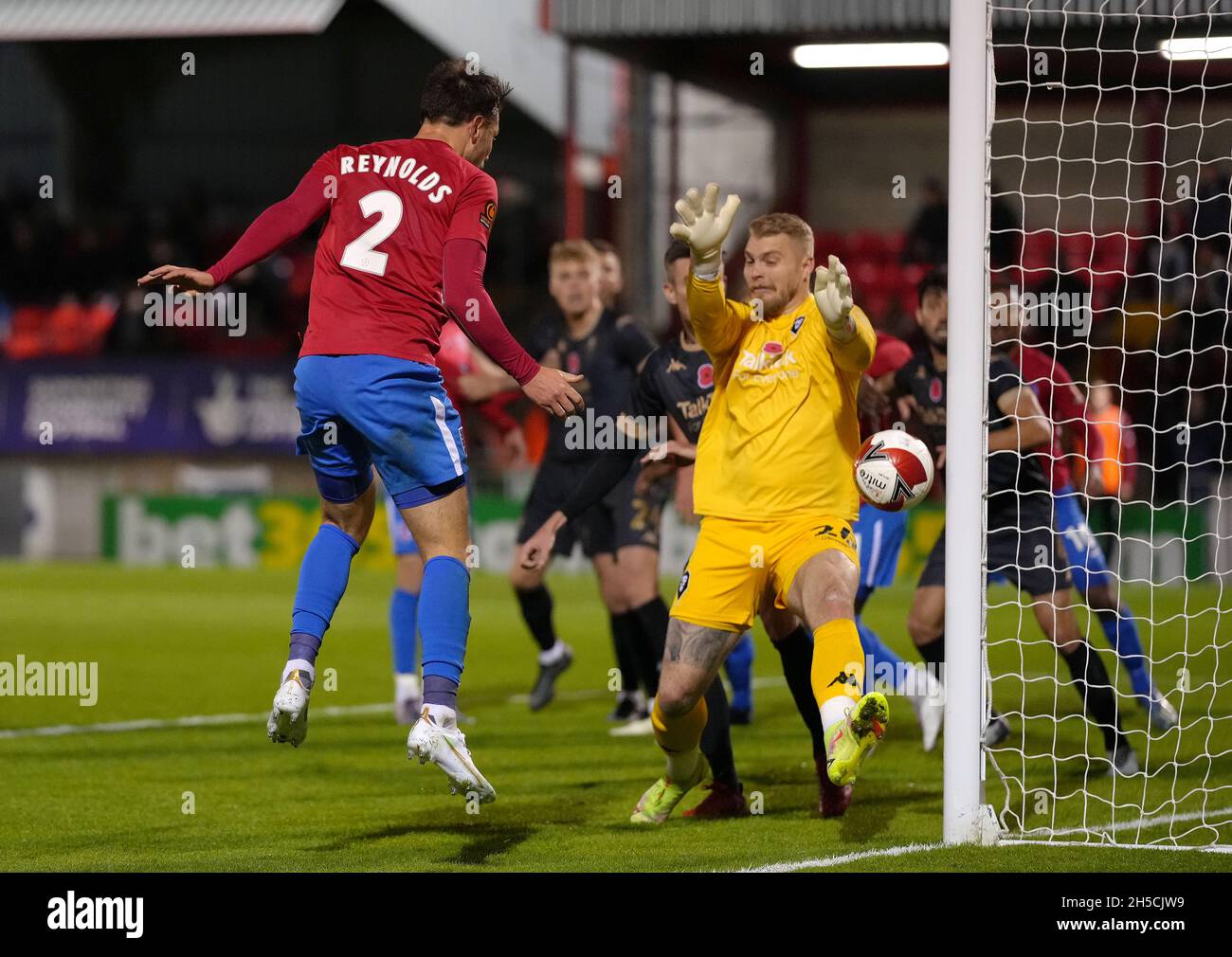 Dagenham and Redbridge's Callum Reynolds sees an effort saved by ...