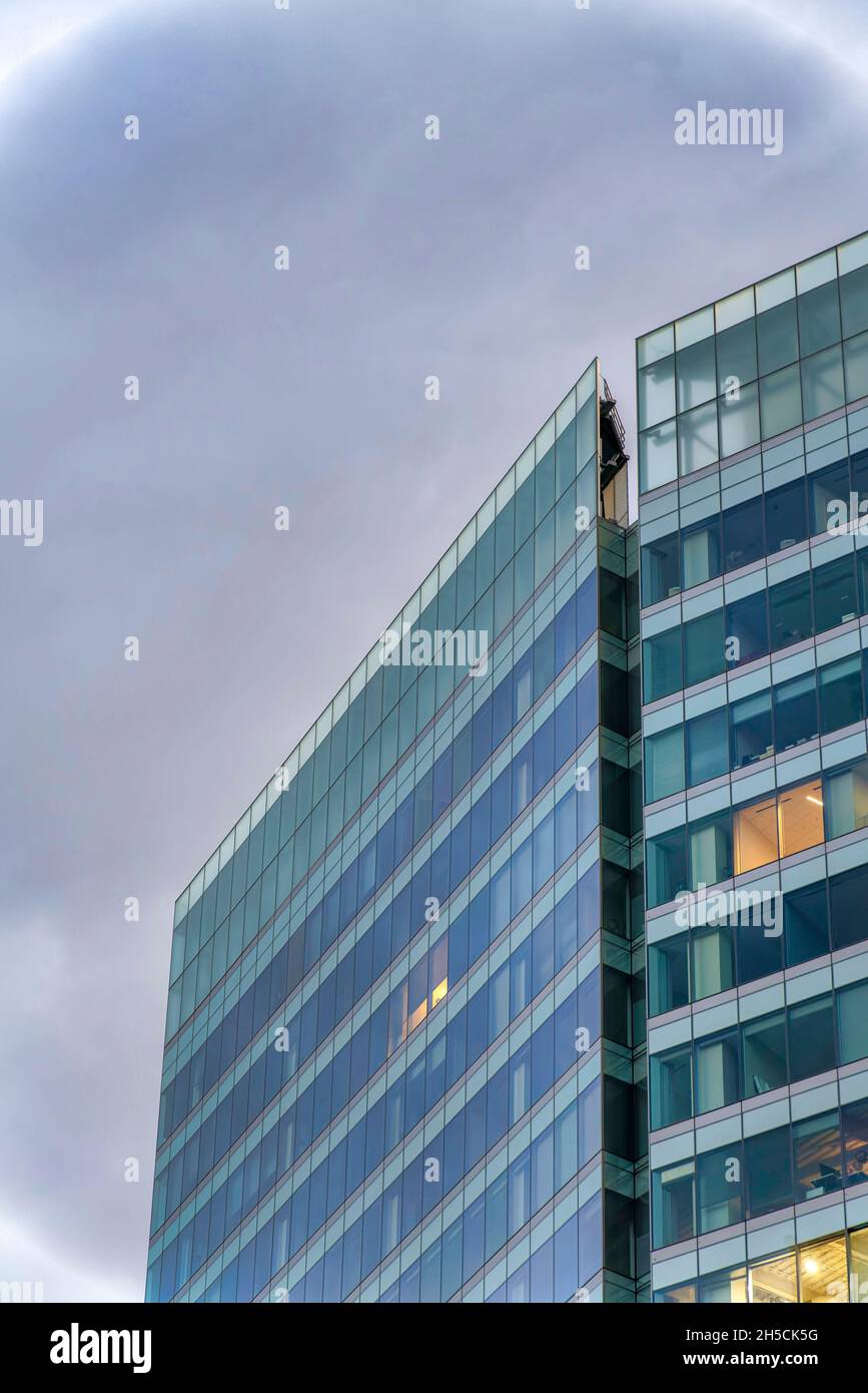 Large building exterior with blue tinted glass curtain walls at Salt ...