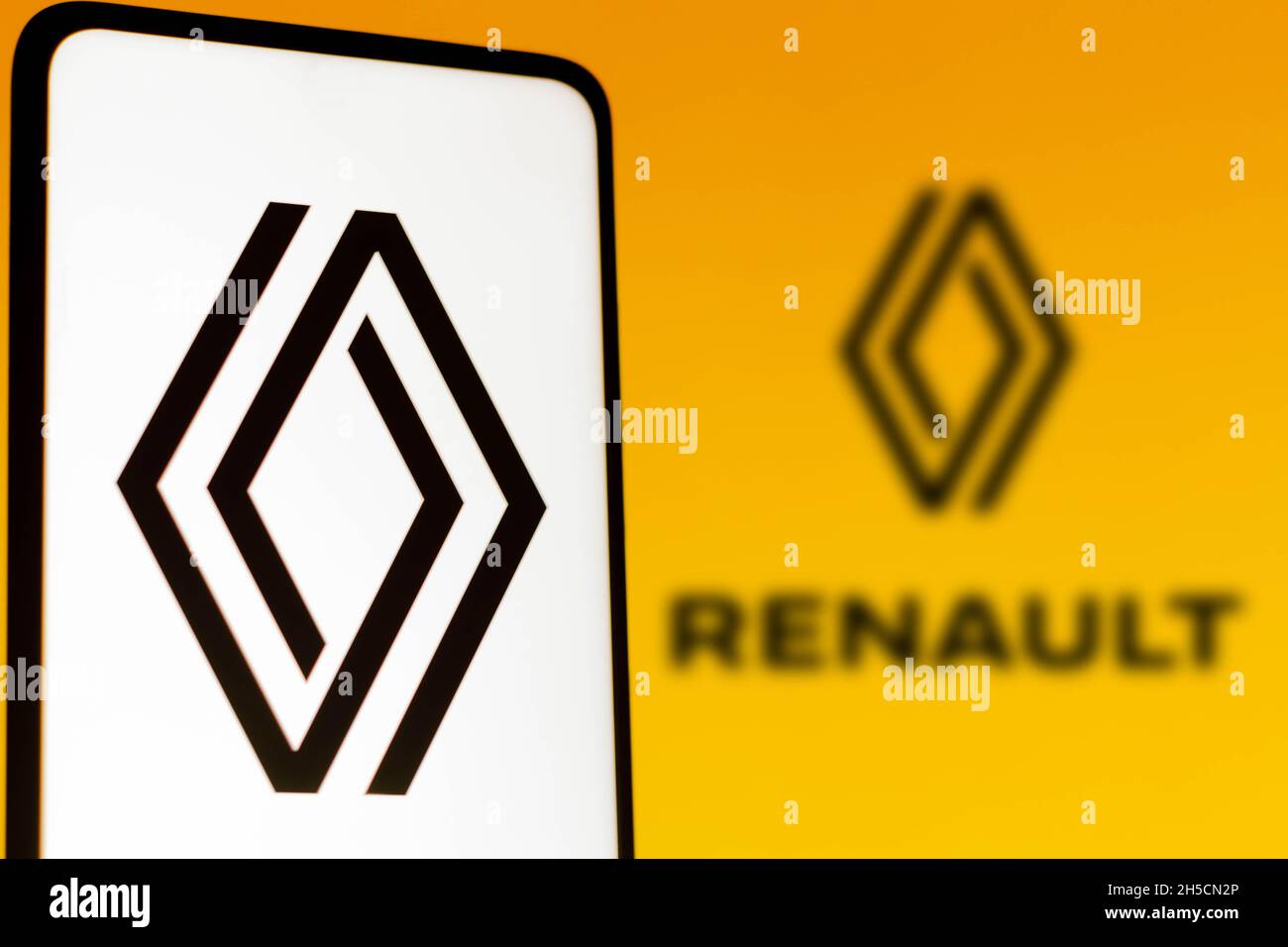 In this photo illustration a Renault logo is seen displayed on a ...