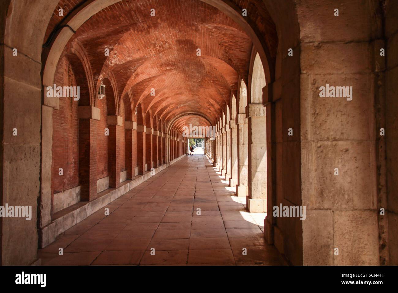 Scenic view of a walking path enclosed with pillars and walls Stock ...