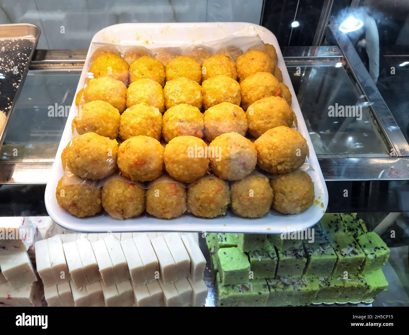 Closeup of Indian sweets assortment in a showcase Stock Photo - Alamy