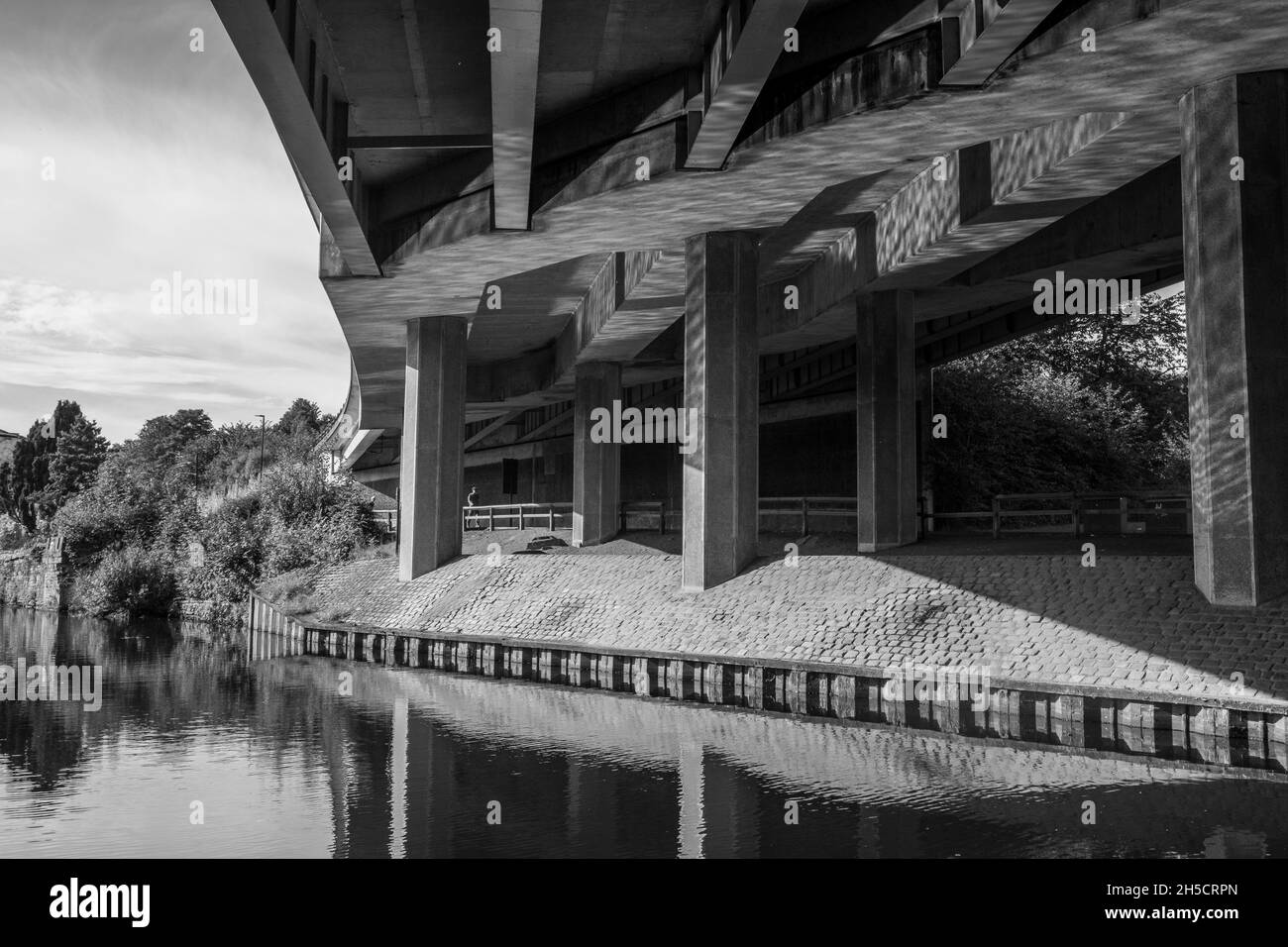 Closeup greyscale underneath Elland bypass with water reflections on ...