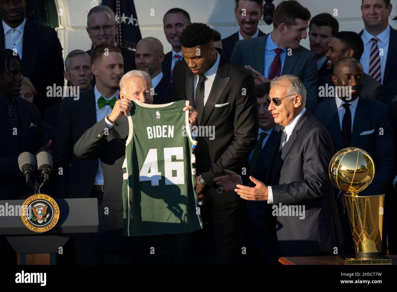 United States President Joe Biden receives a team jersey from Milwaukee ...