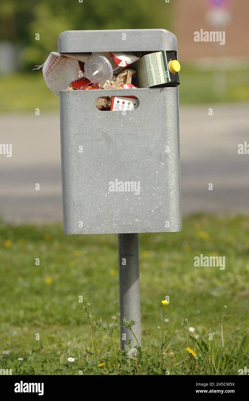 overfilled dustbin in a park, Germany Stock Photo - Alamy