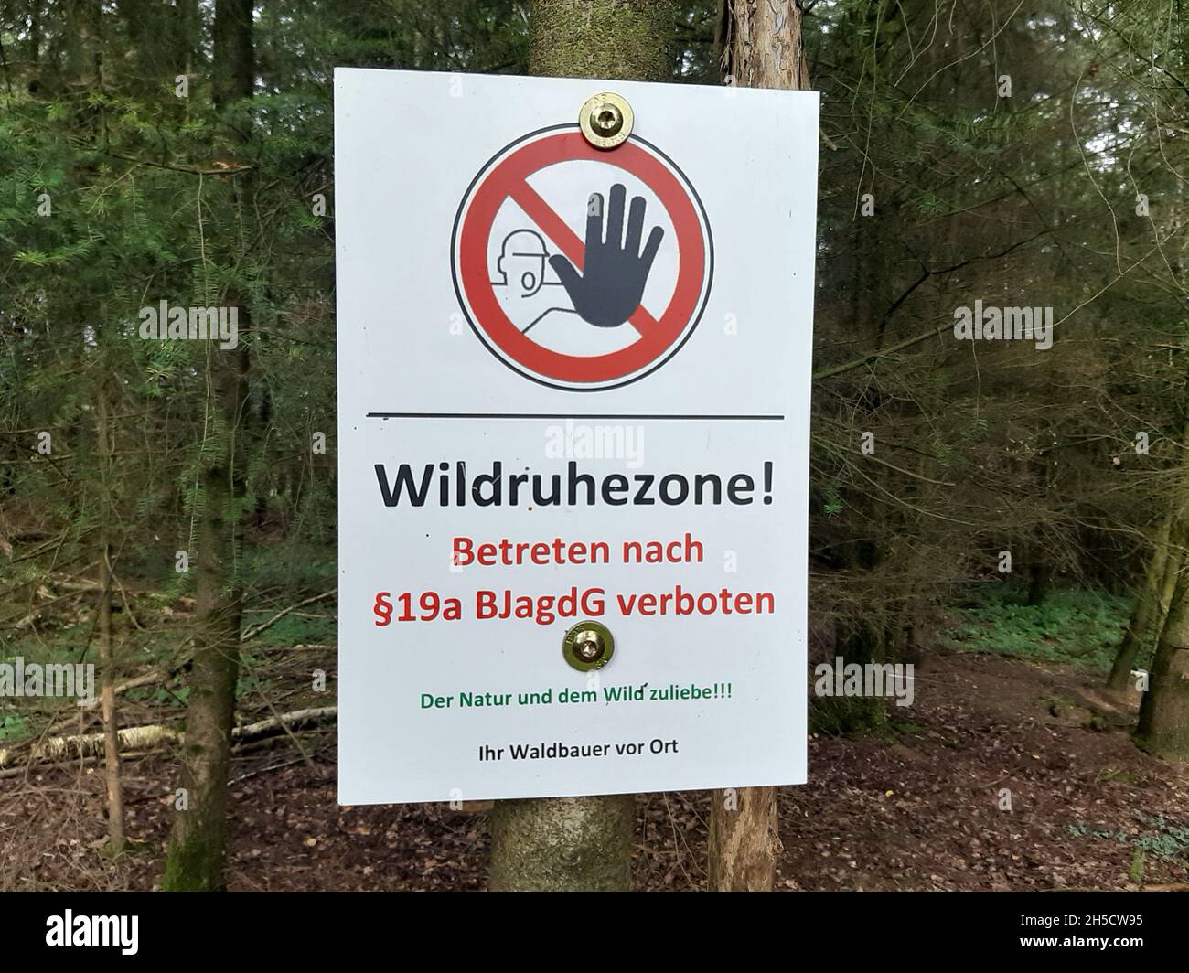 sign 'Wildlife Rest Zone' in the forest Stock Photo - Alamy