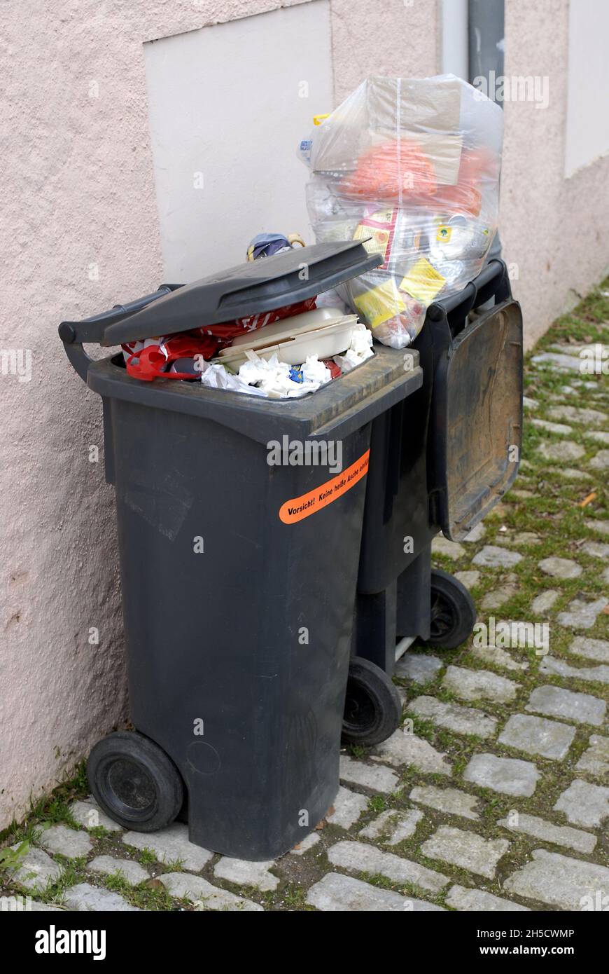 overstuffed trashcan, Germany Stock Photo - Alamy