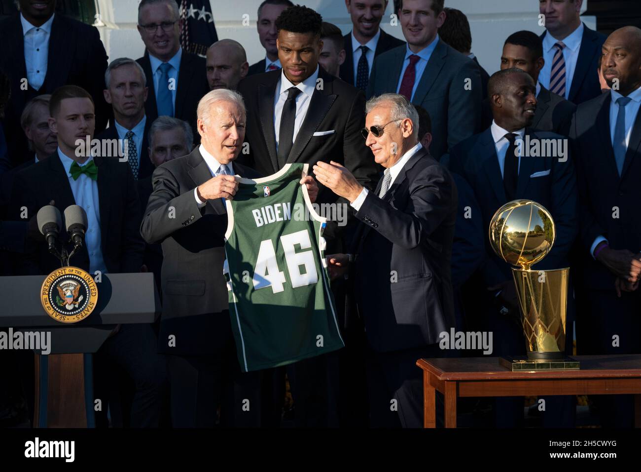 United States President Joe Biden receives a team jersey from Milwaukee ...