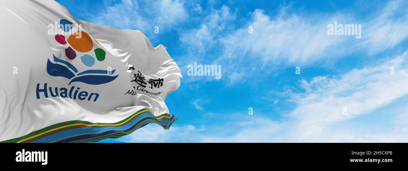 flag of Hualien, County at cloudy sky background on sunset, panoramic ...