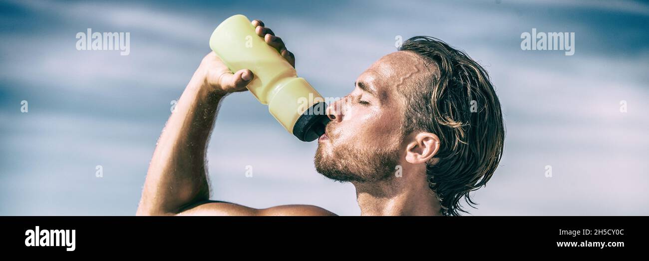 Athlete drinking water bottle during intense training workout sweating ...