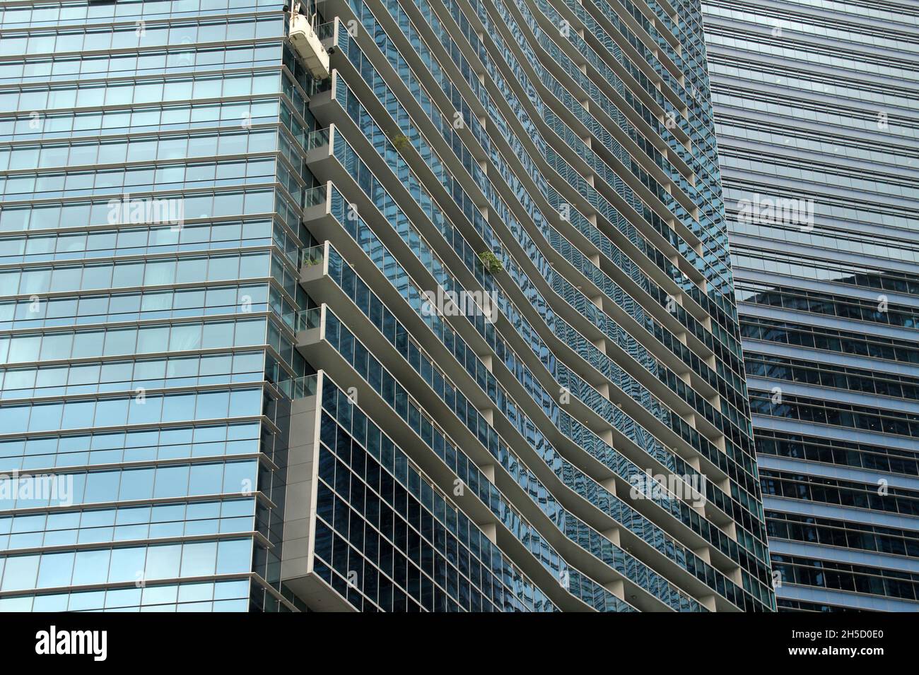 Low angle of a high modern building with shiny glass windows in ...