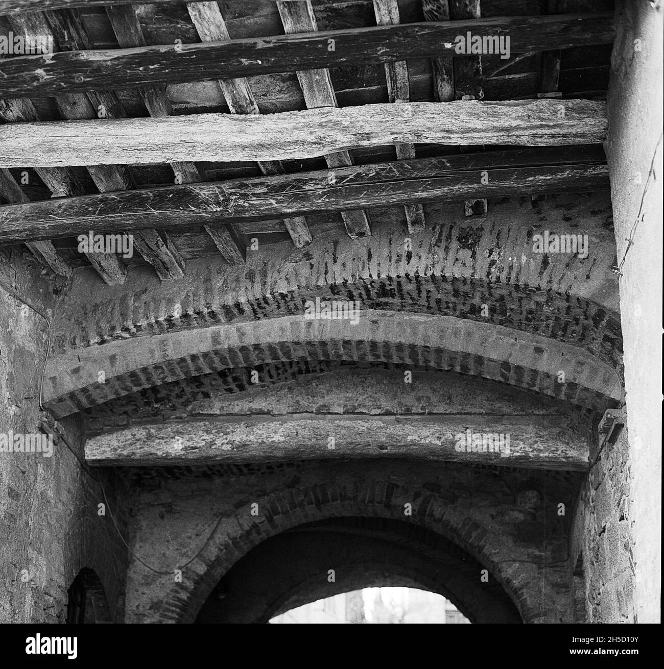 Grayscale shot of an old archway with wooden ceiling Stock Photo - Alamy