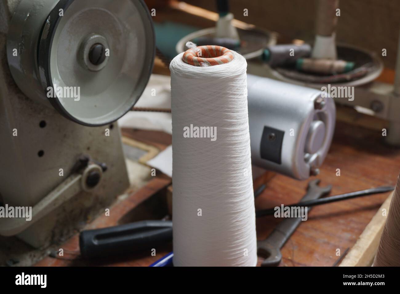 Thread with a natural background Stock Photo - Alamy
