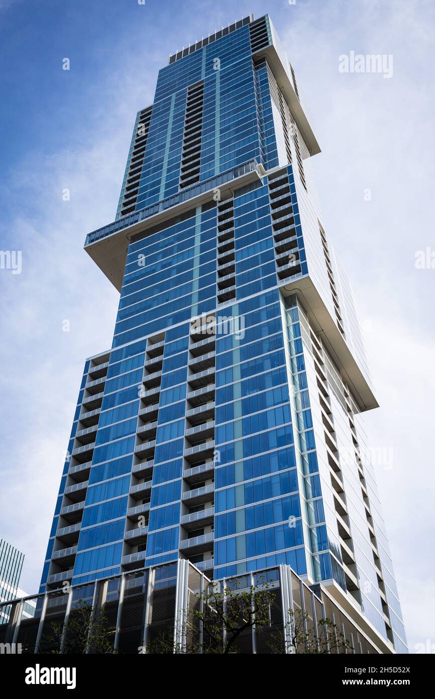 Tall Office Building in Austin with Blue Sky Stock Photo - Alamy