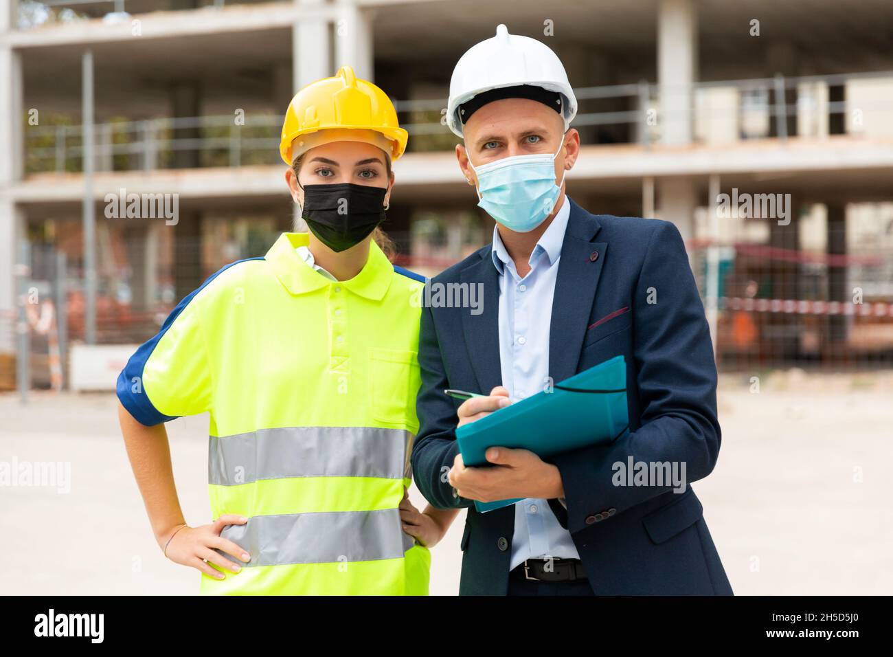 Engineers in face masks in construction plant Stock Photo - Alamy