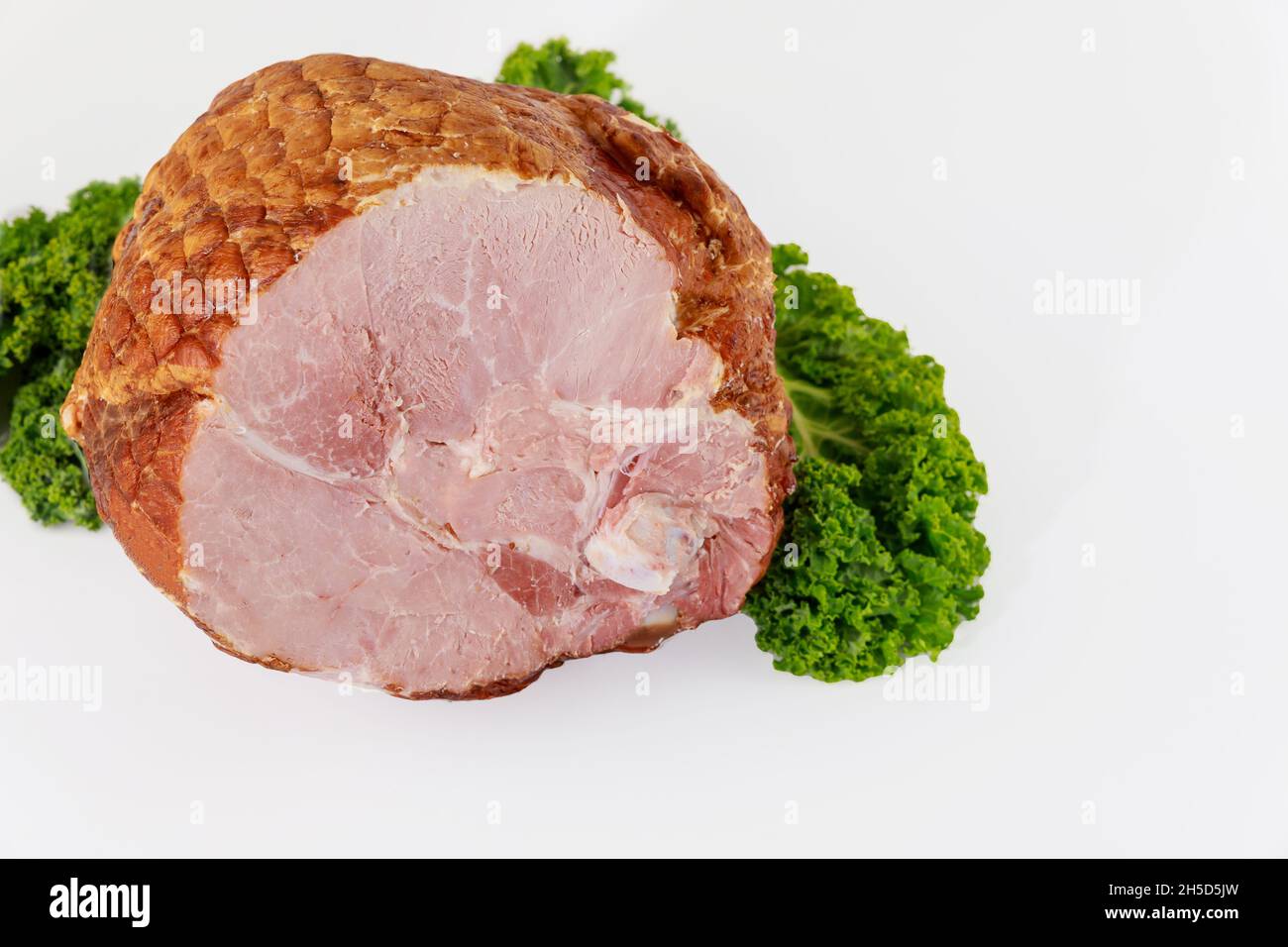 Pork ham sliced with herb on white background Stock Photo - Alamy