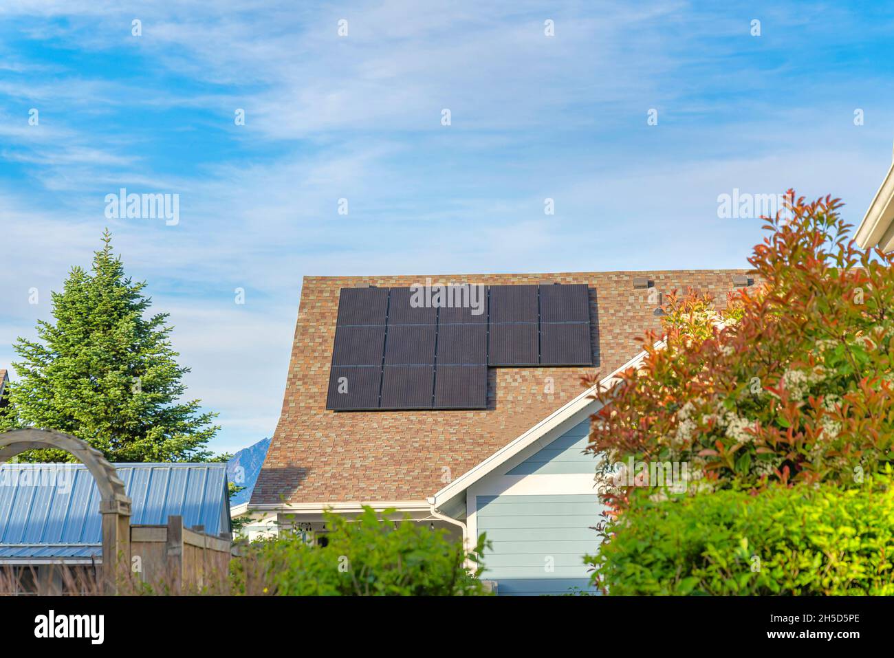 Solar panel on a roof of a house with asphalt composite shingles at ...