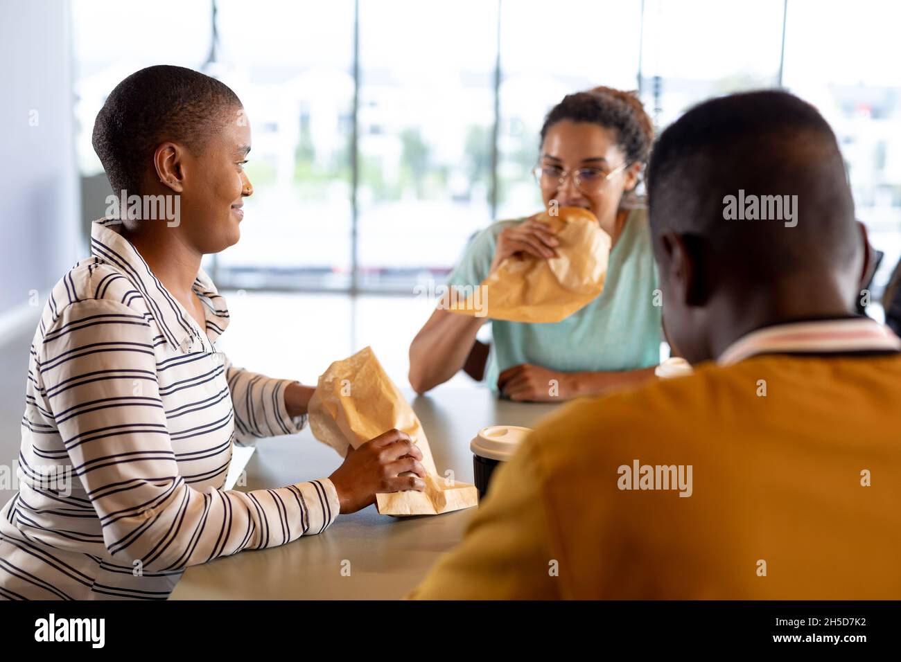 Eating snacks at work desk hi-res stock photography and images - Alamy