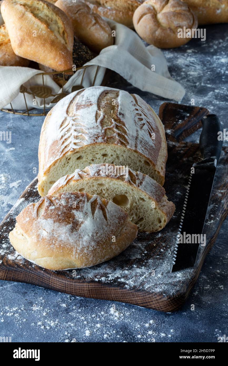 Close up of a decorated sourdough loaf sliced into Stock Photo - Alamy