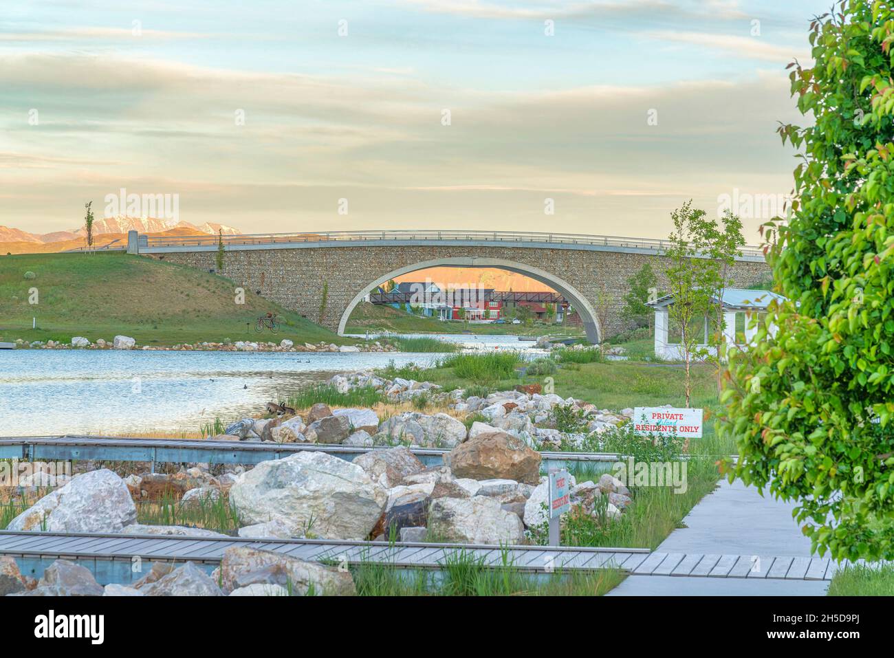 Wooden docks on Oquirrh Lake with signage post at Daybreak, Utah Stock ...
