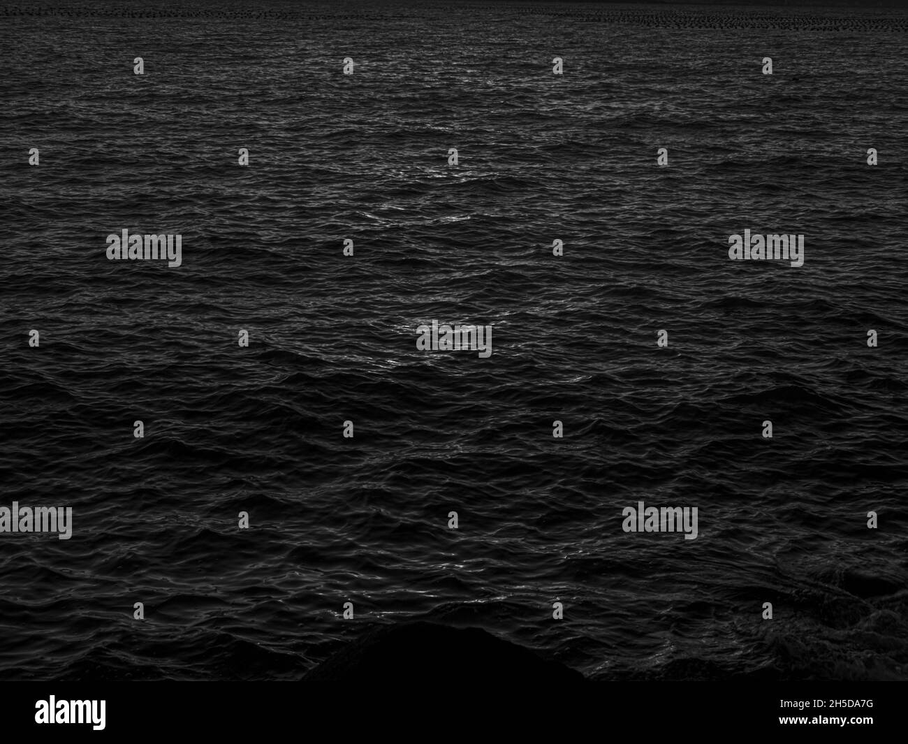 Grayscale shot of the sea waves in the daylight - perfect for ...