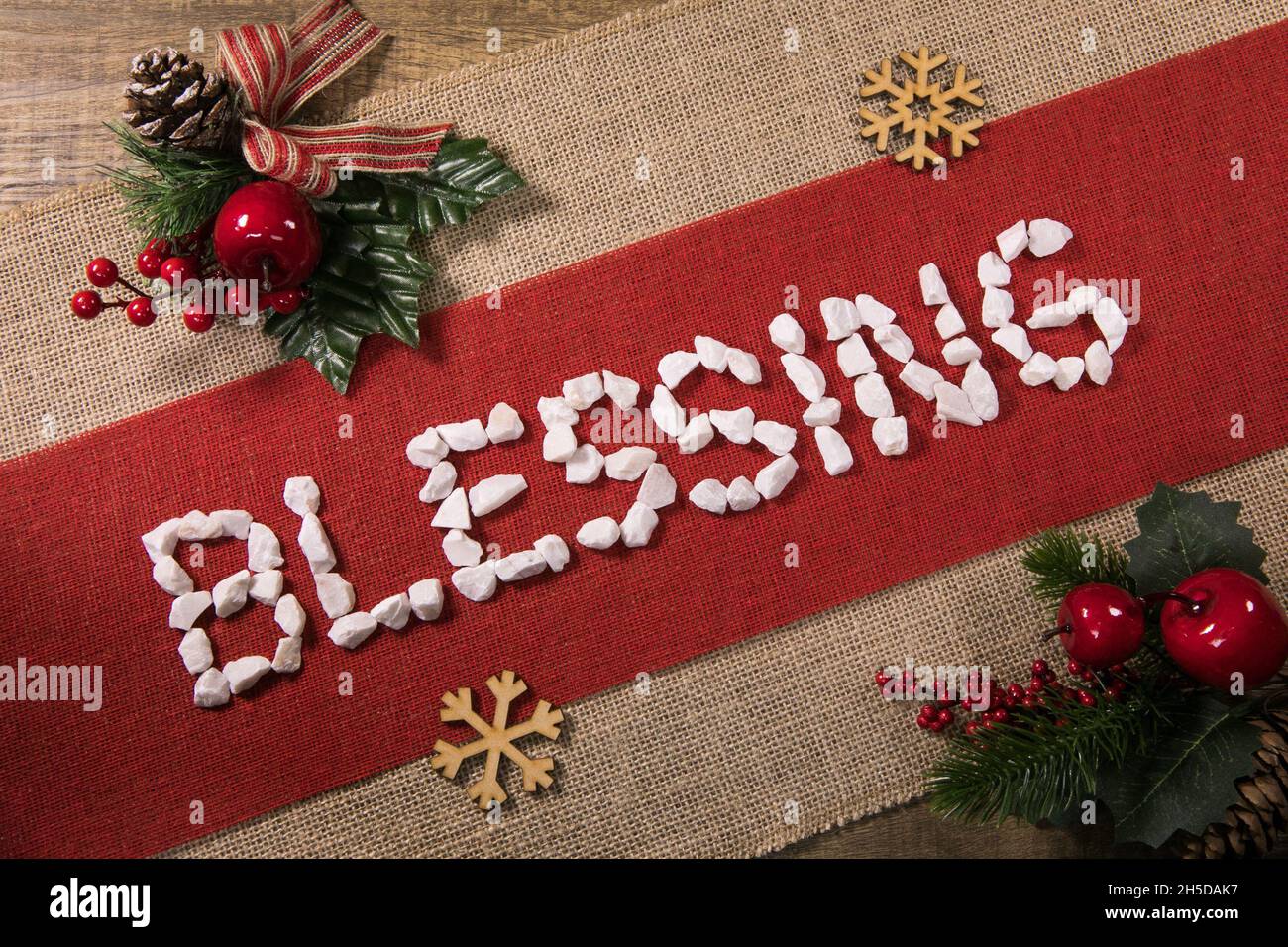 Top view of the "Blessing" word with wooden snowflakes and pine ...