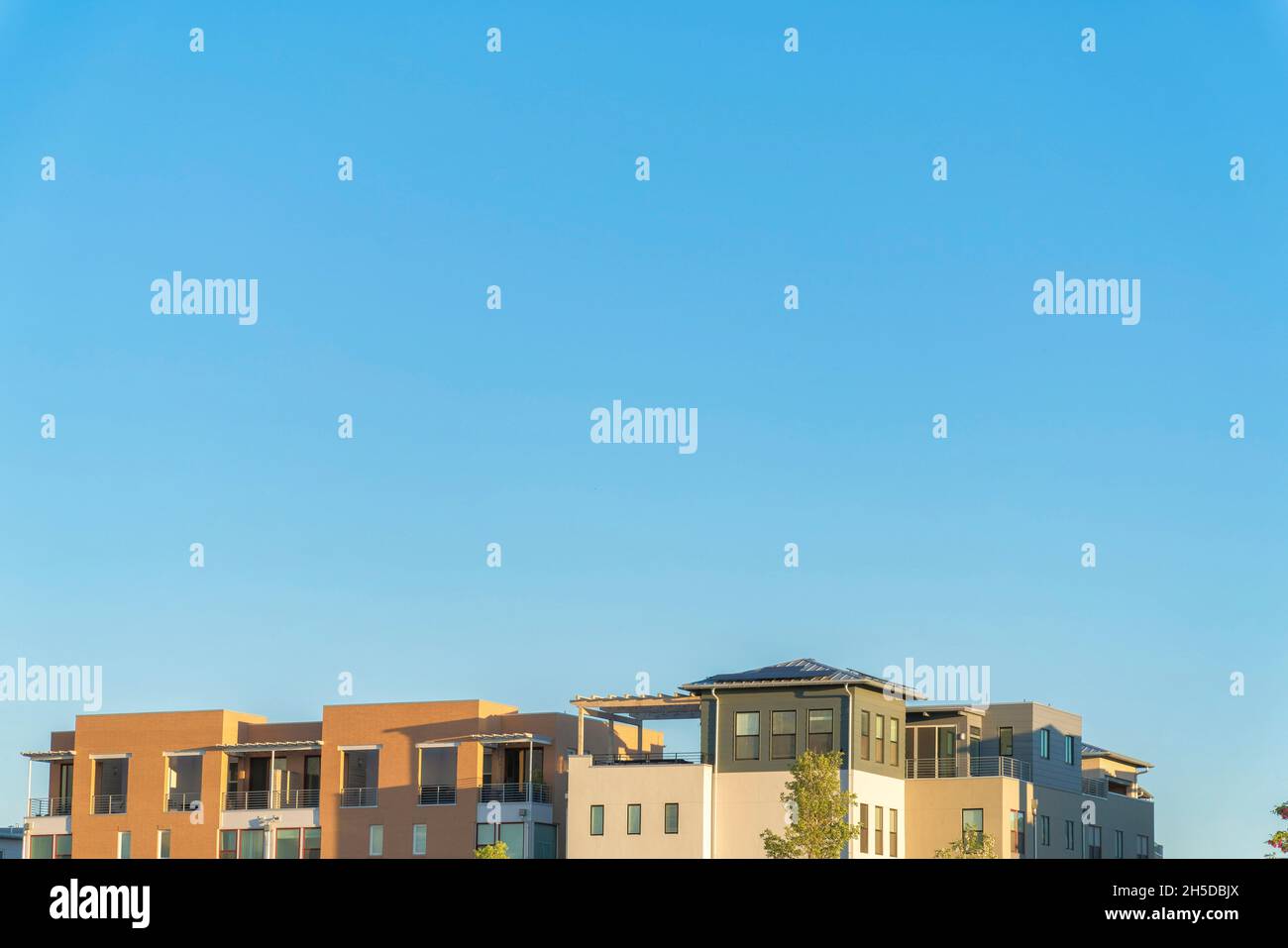 Exterior of the top floors of two complex apartment buildings with ...