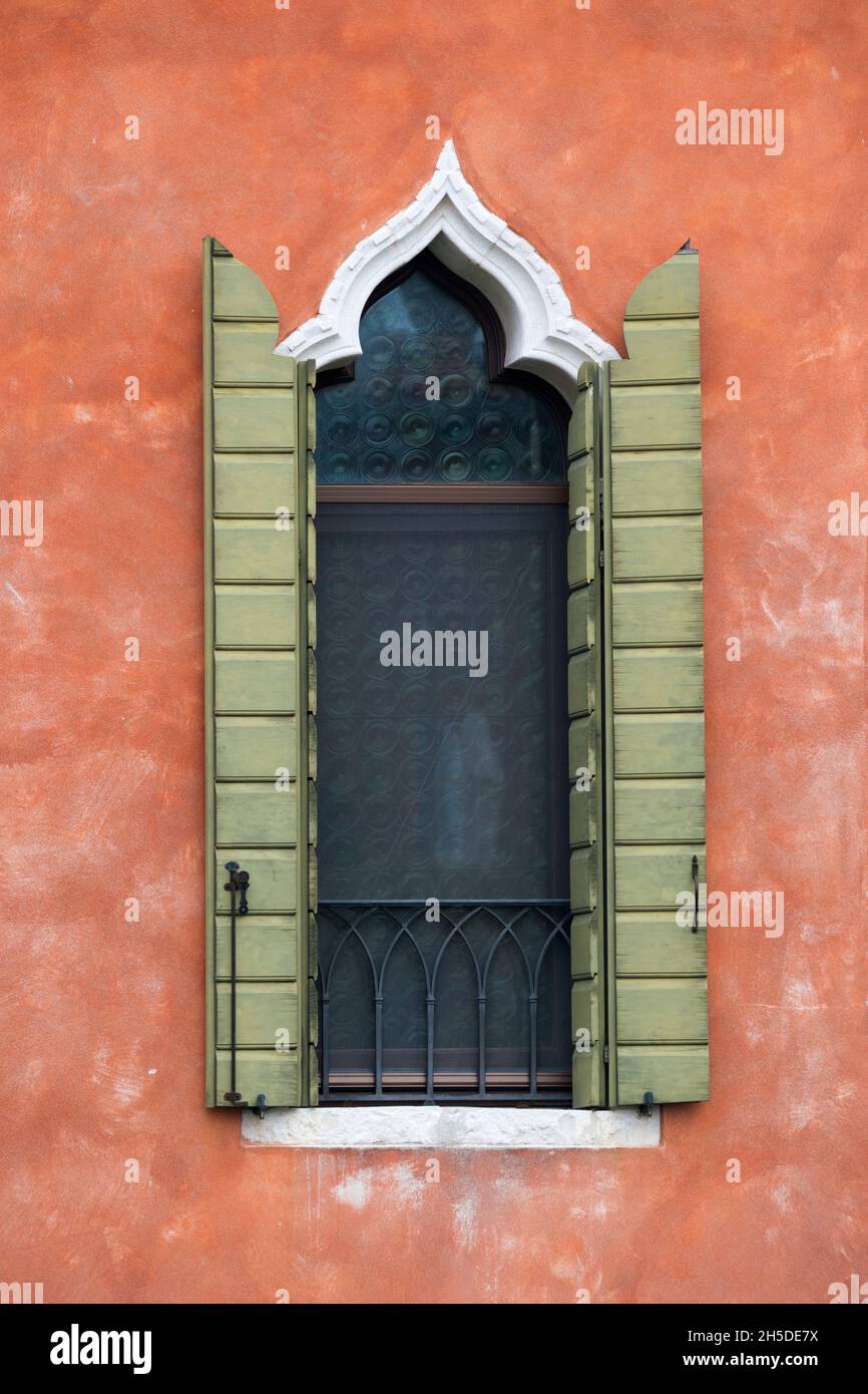 scenic shape of old Italian window on red building wall in Venice Stock ...