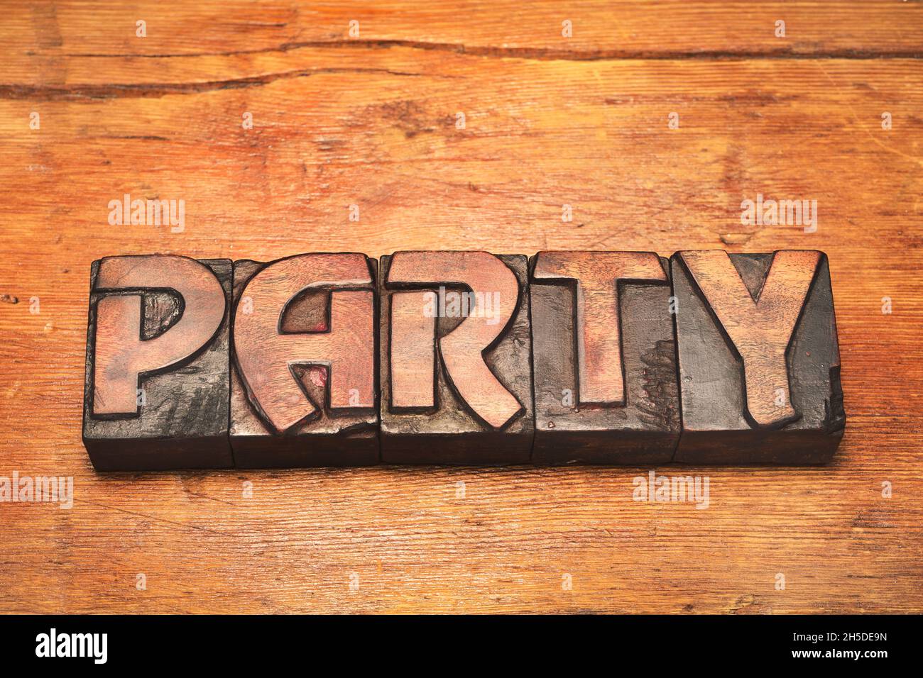 party word made from vintage letterpress blocks on wooden surface Stock ...